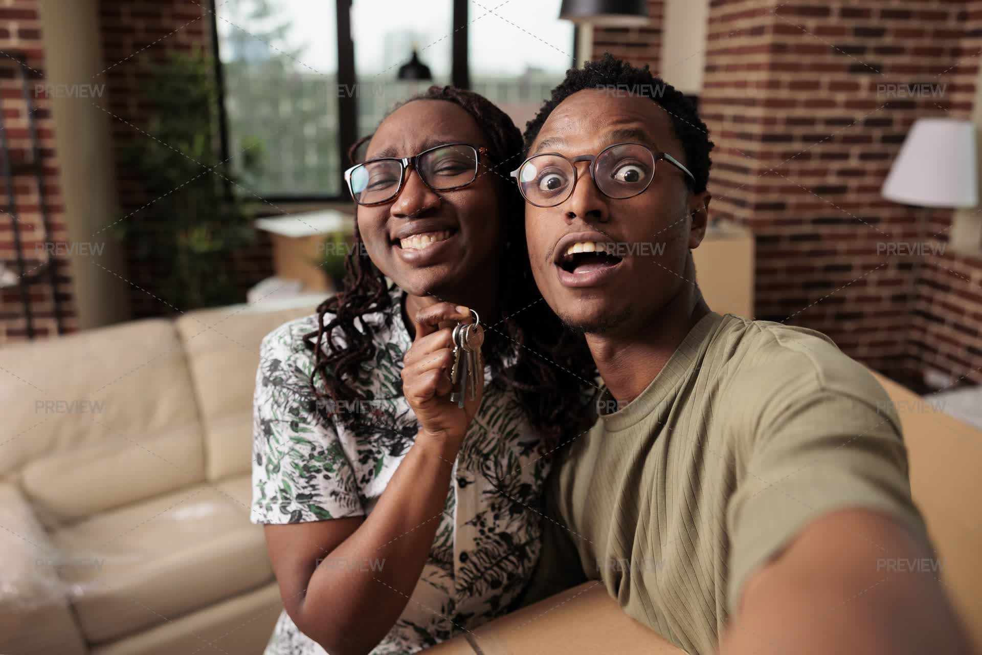 Couple Celebrates Getting House Keys - Stock Photos | Motion Array Couple Celebrates Getting House Keys - Stock Photos | Motion Array