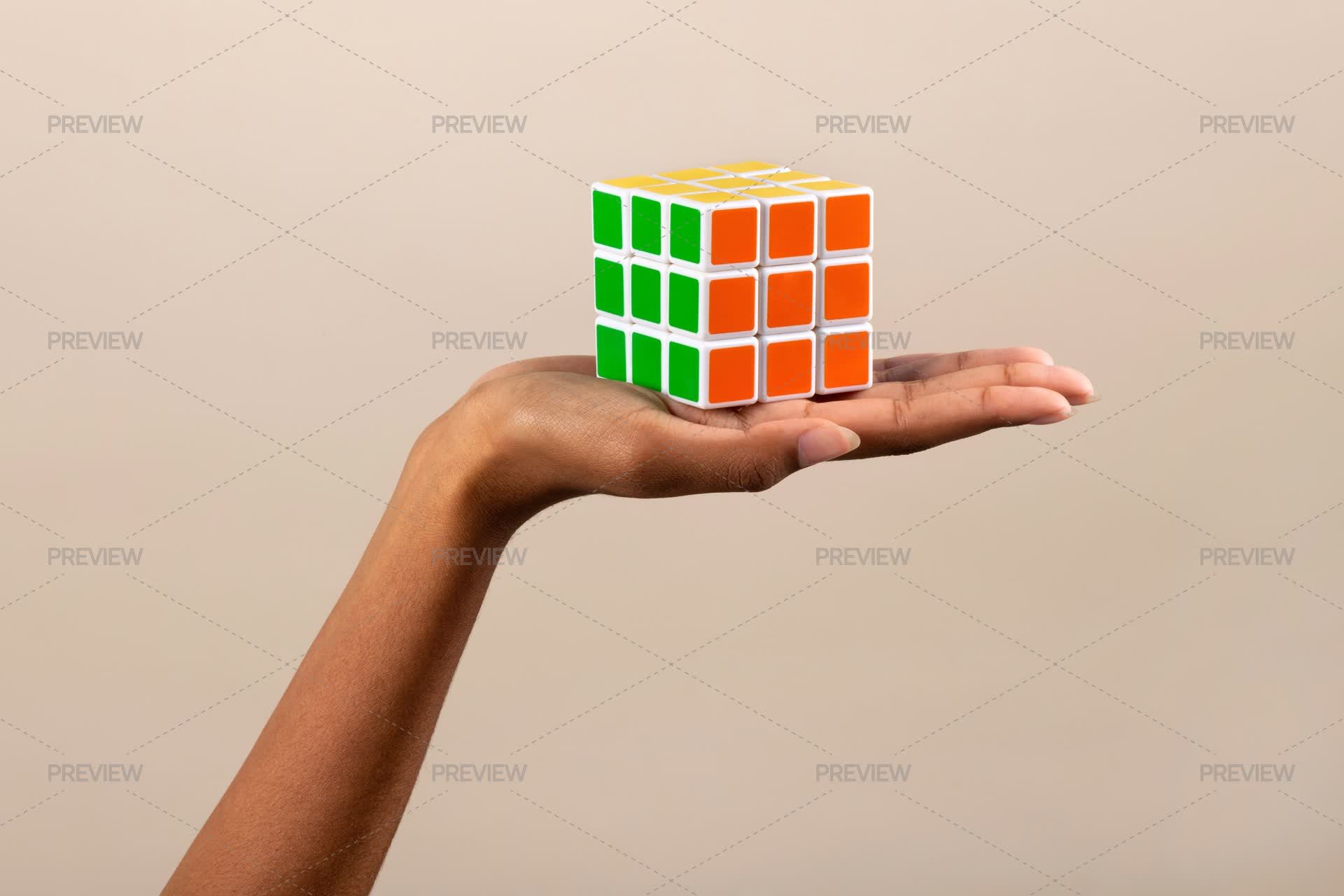 Hand Showing A Solved Rubik Cube - Stock Photos | Motion Array Hand Showing A Solved Rubik Cube - Stock Photos | Motion Array