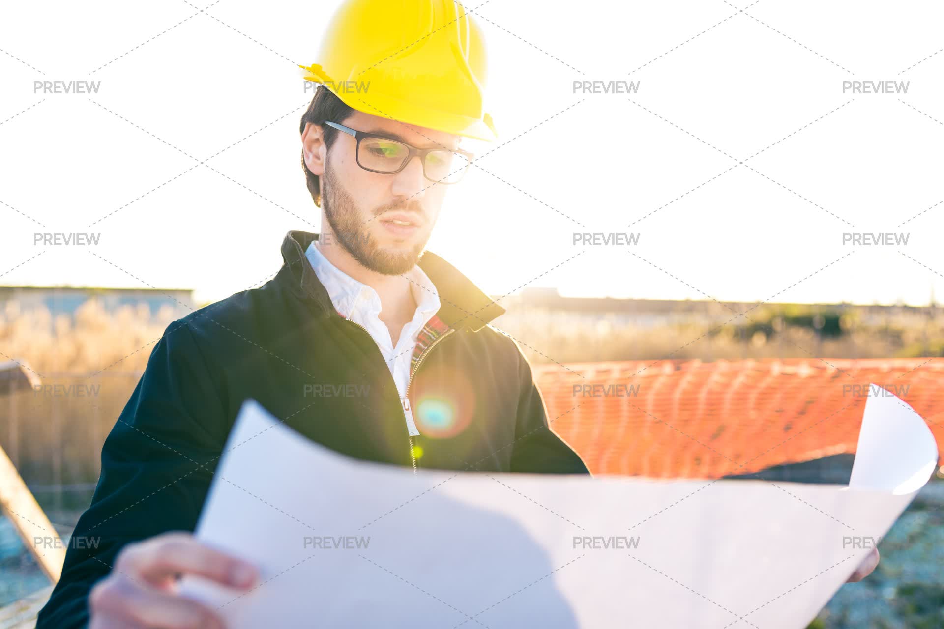 Engineer Watching Blueprints - Stock Photos | Motion Array Engineer Watching Blueprints - Stock Photos | Motion Array
