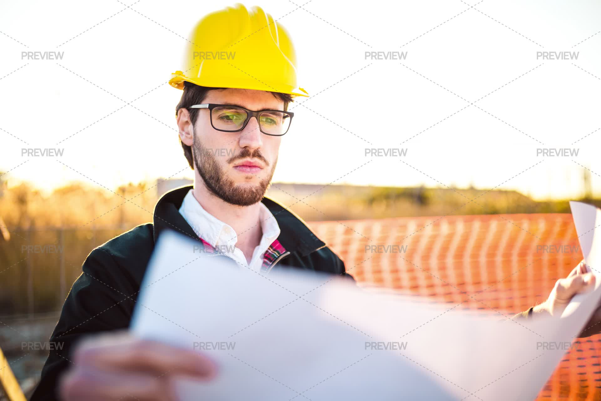 Engineer Watching The Project Sheet - Stock Photos | Motion Array Engineer Watching The Project Sheet - Stock Photos | Motion Array