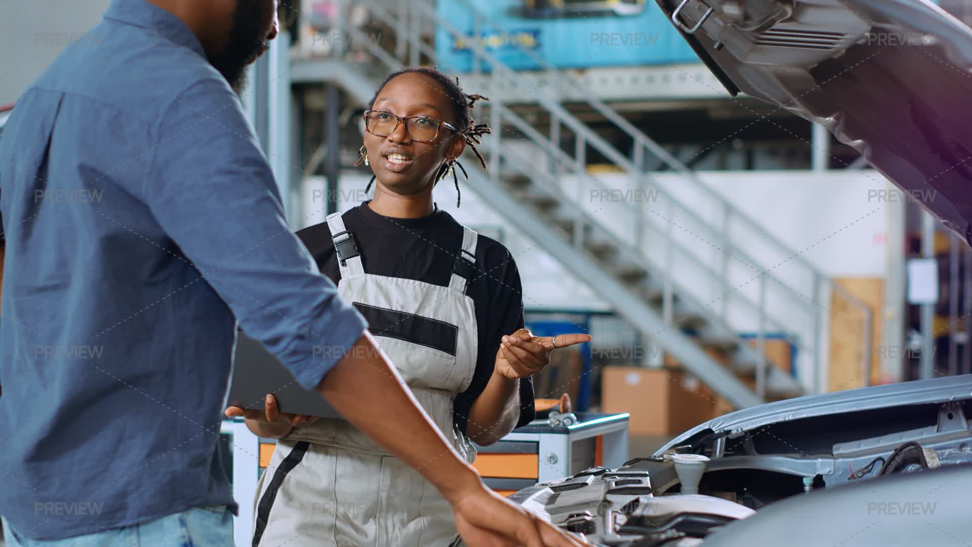 Specialist Calculates Car Fix Services - Stock Photos | Motion Array Specialist Calculates Car Fix Services - Stock Photos | Motion Array