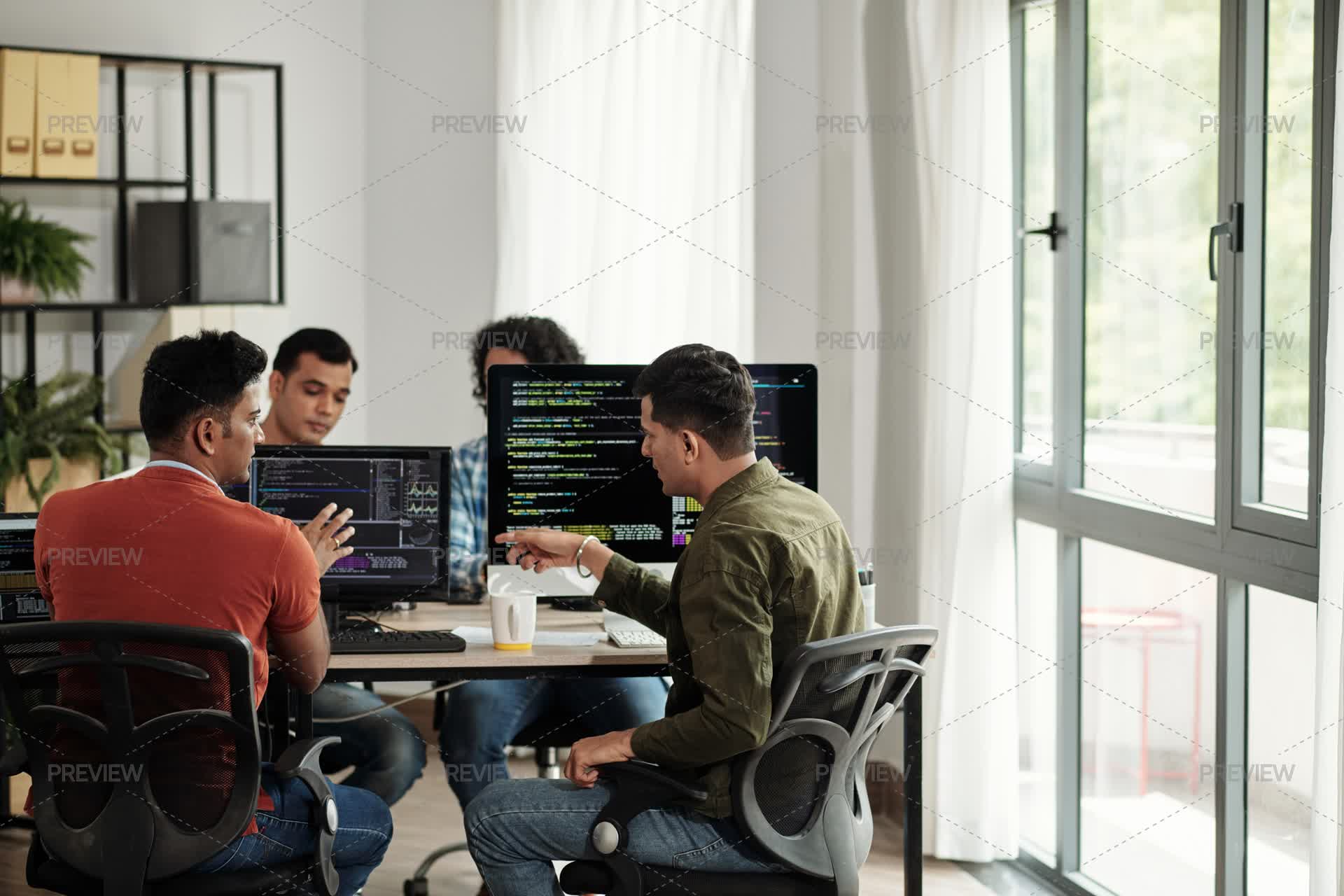 Developers Discussing Programming Code - Stock Photos | Motion Array Developers Discussing Programming Code - Stock Photos | Motion Array
